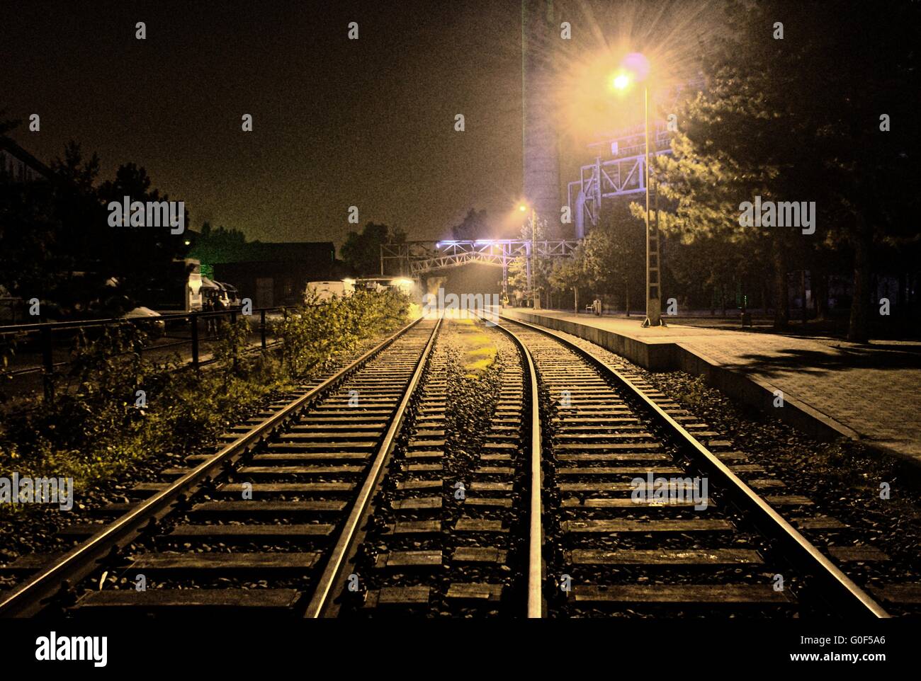 Railroad track at night Stock Photo - Alamy
