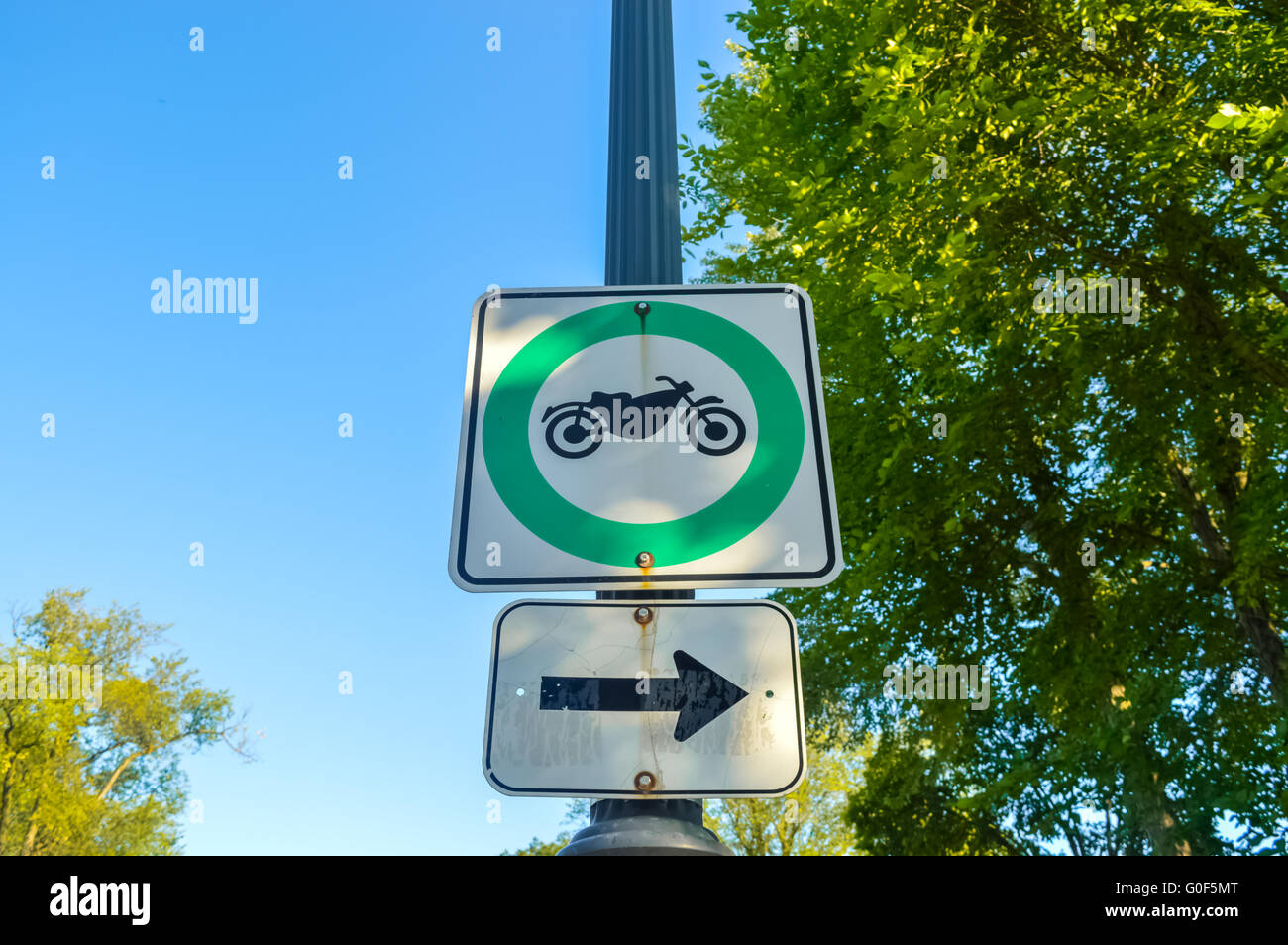 Permitted motorcycles traffic sign in retro style Stock Photo - Alamy