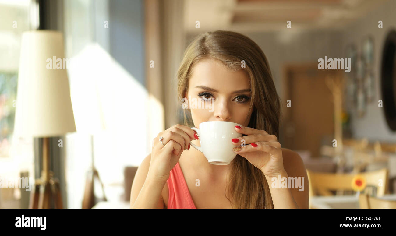 Attractive adult woman drinks coffee hi-res stock photography and ...