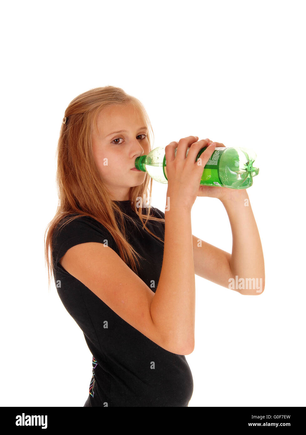 Girl drinking pop from bottle Stock Photo - Alamy