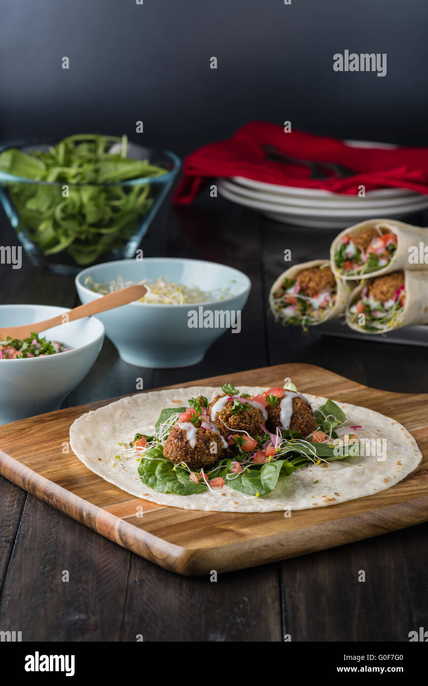 Vegan Falafel Wrap With Salsa and salad Stock Photo - Alamy