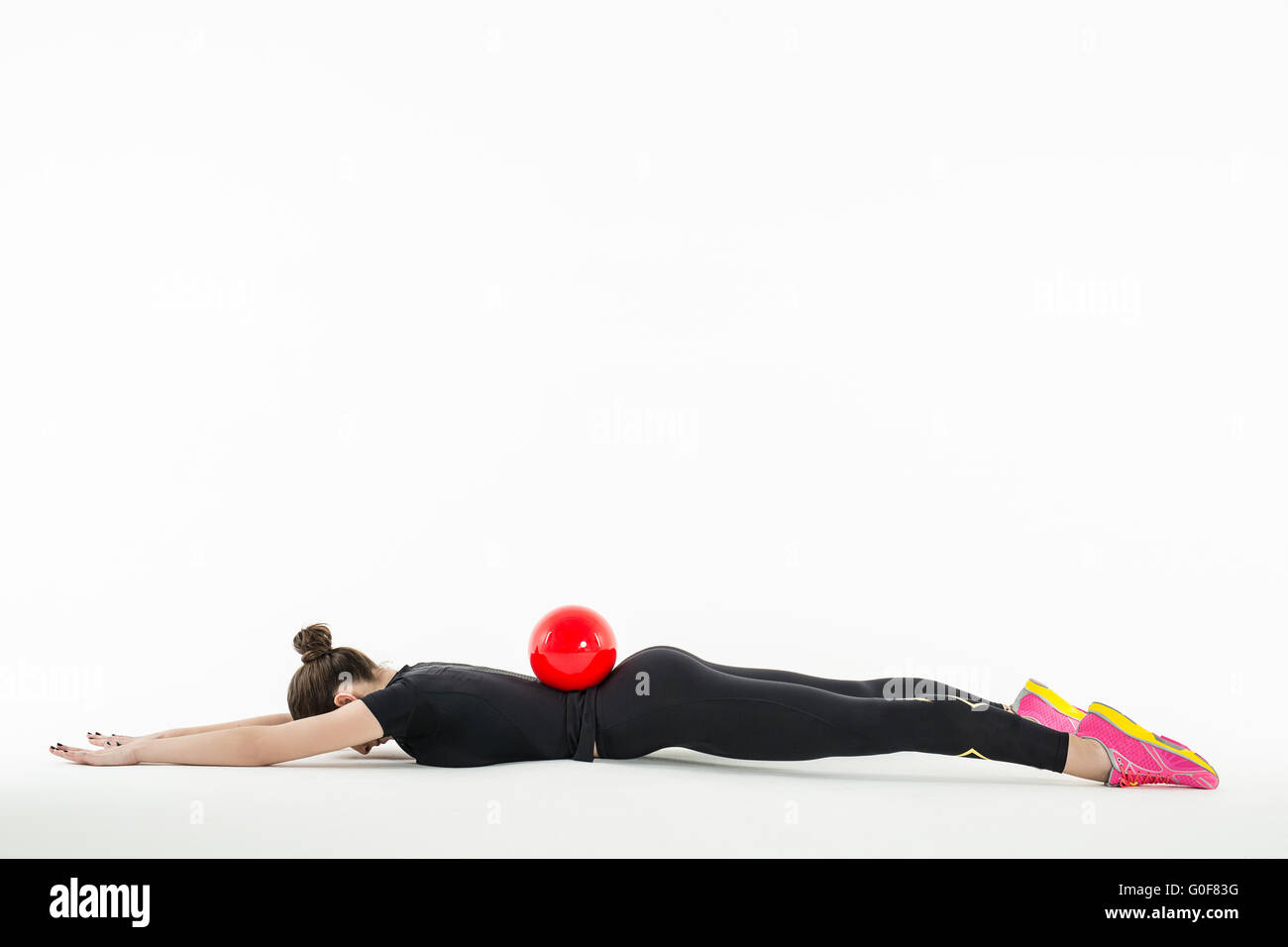 Rhythmic gymnast doing exercise with ball in studio Stock Photo - Alamy