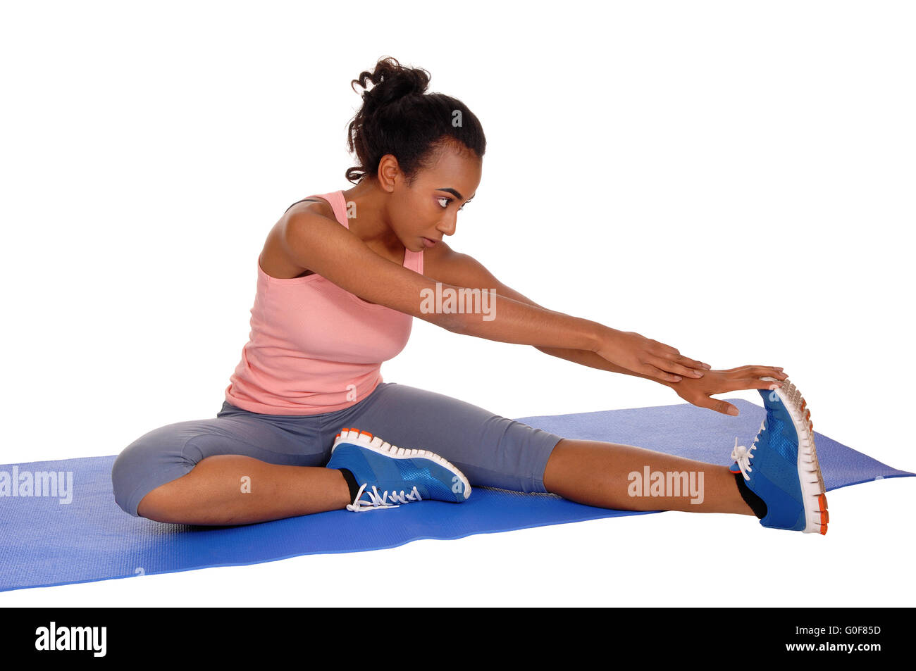 Beautiful african american woman stretching Stock Photo - Alamy