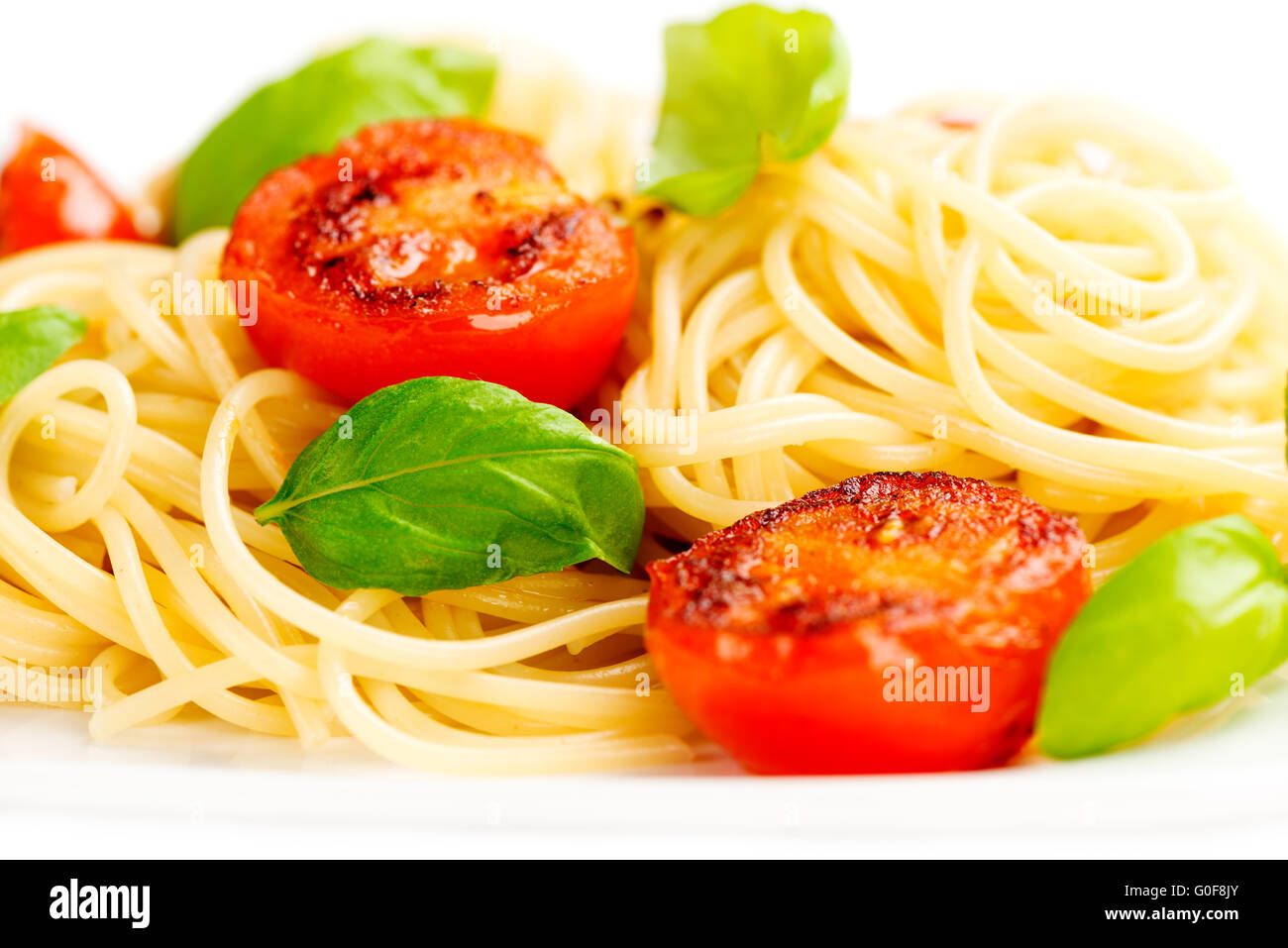 Traditional italian macaroni pasta with grilled tomato and oregano ...