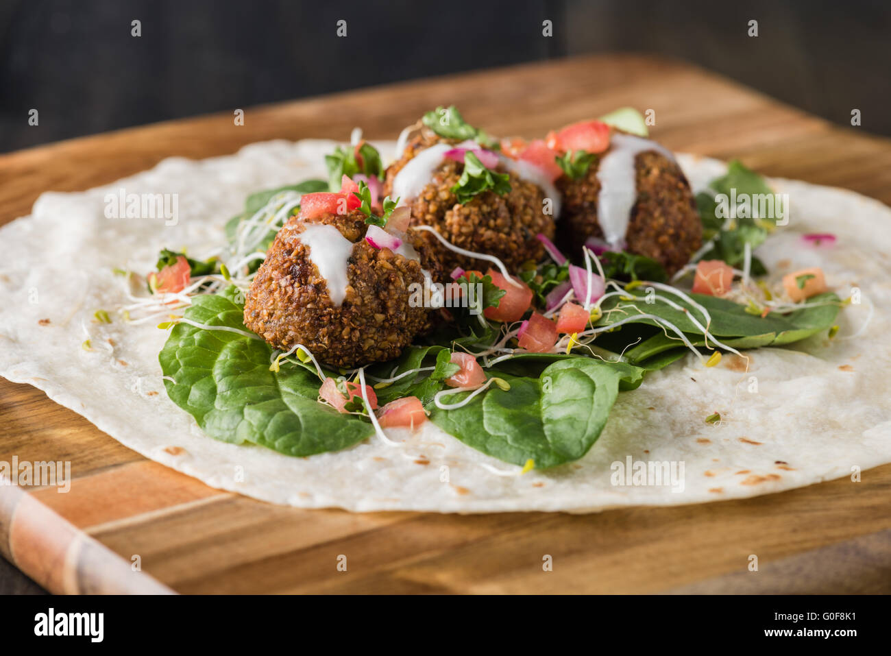 Vegan Falafel Wrap With Salsa and salad Stock Photo - Alamy