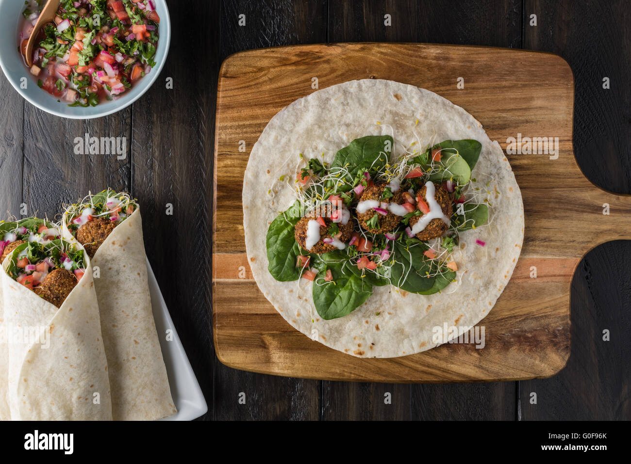 Vegan Falafel Wrap With Salsa and salad Stock Photo - Alamy