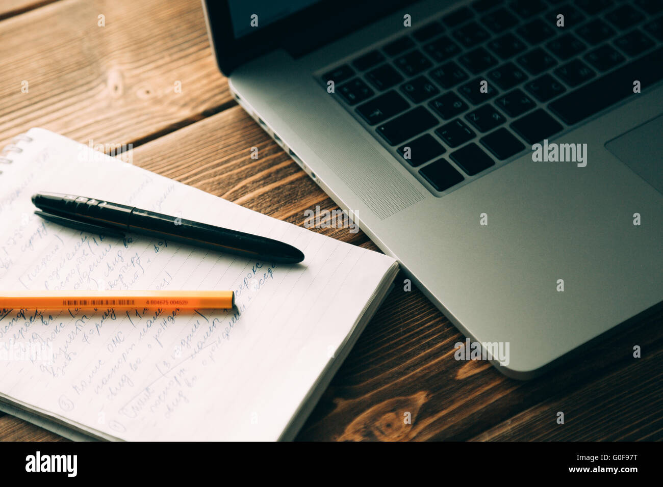 Workplace with open laptop on modern wooden desk Stock Photo - Alamy