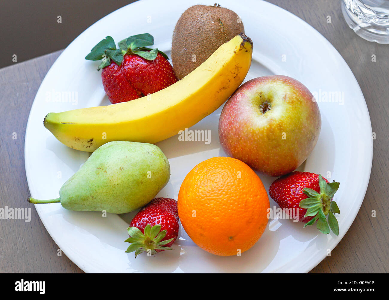Fruit plate orange apple strawberries hi-res stock photography and ...
