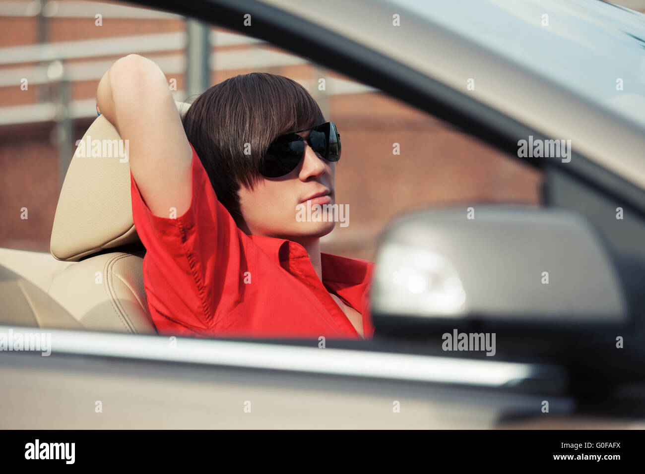 Cool guy driving convertible car hi-res stock photography and images ...