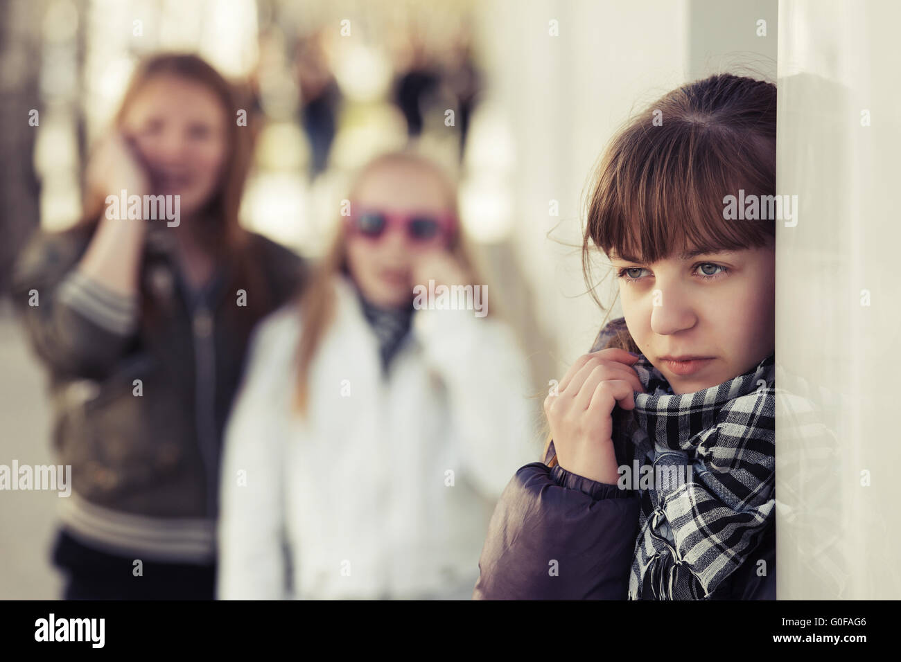 Teenage girls in conflict at the school building Stock Photo - Alamy