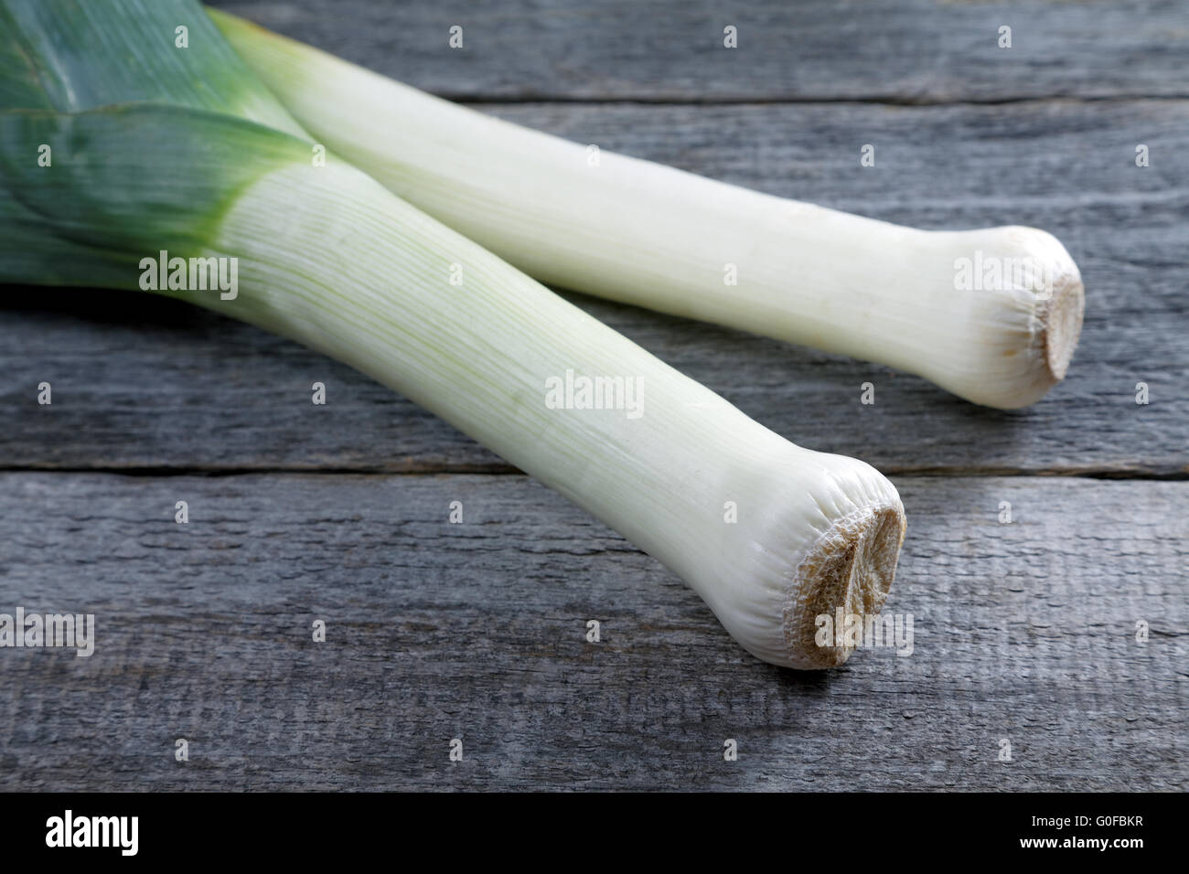 large shallot stalks on a rustic table Stock Photo - Alamy