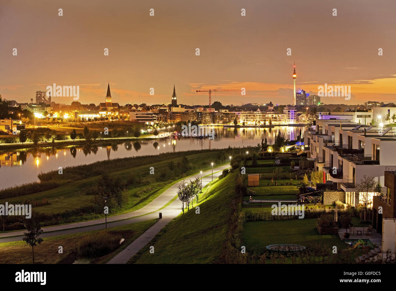 Phoenix Lake with residential areas and the Florian Tower at sunset ...