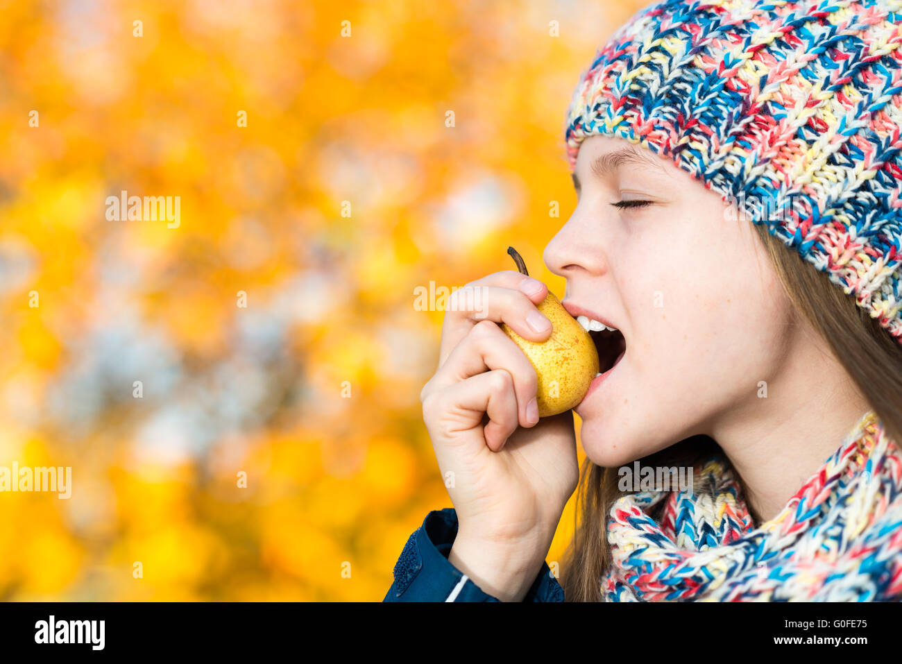 Girl Eating Pear Stock Photo - Alamy