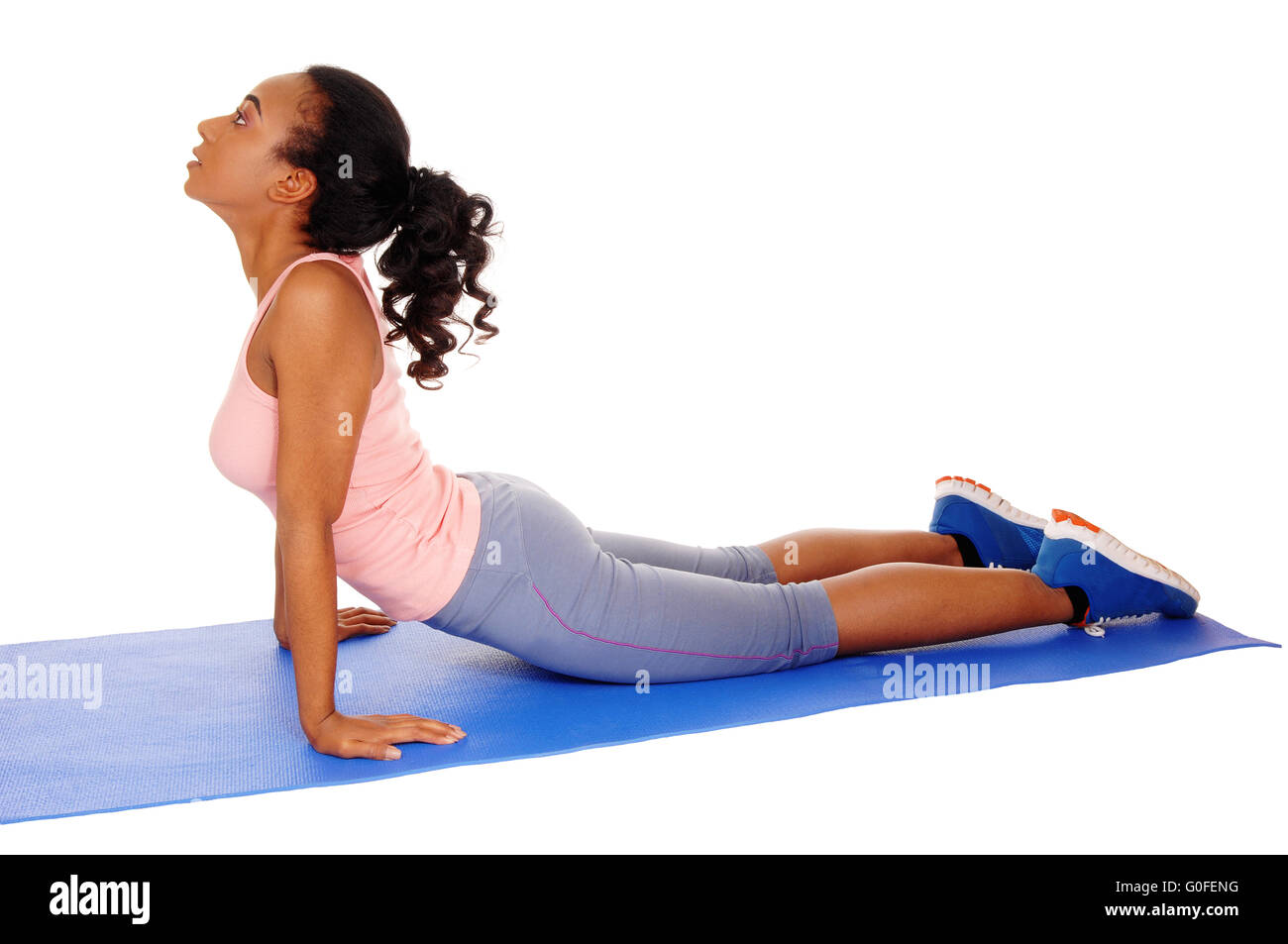 Beautiful African American woman stretching Stock Photo - Alamy