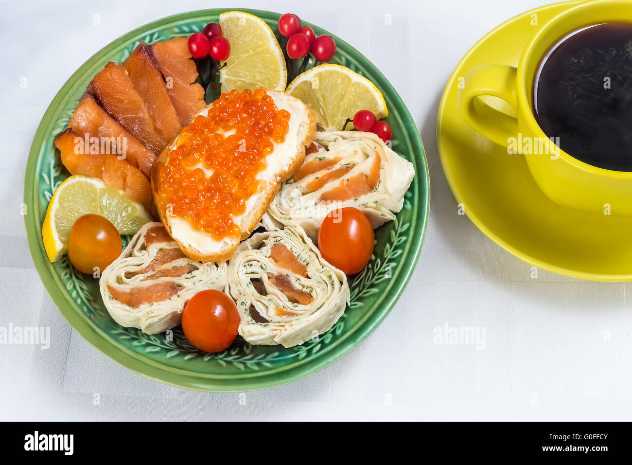 Snacks with fish and black coffee Stock Photo - Alamy