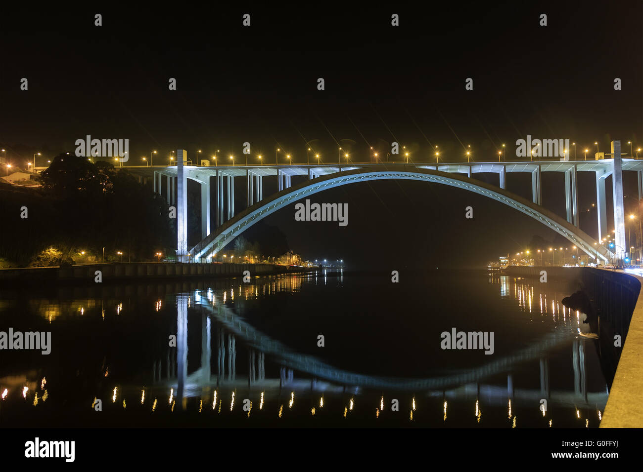 Arrabida bridge and lights on Douro river Stock Photo - Alamy