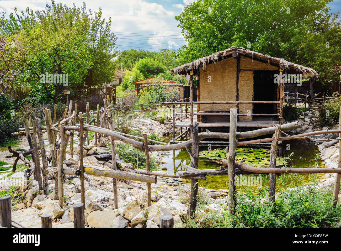 Hut with Pond Stock Photo - Alamy