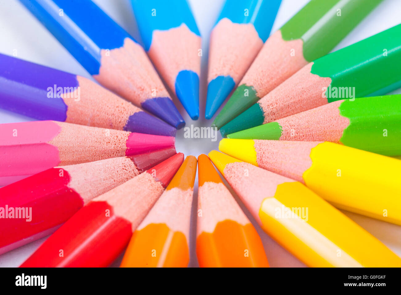 Colored pencils arranged round figure Stock Photo - Alamy