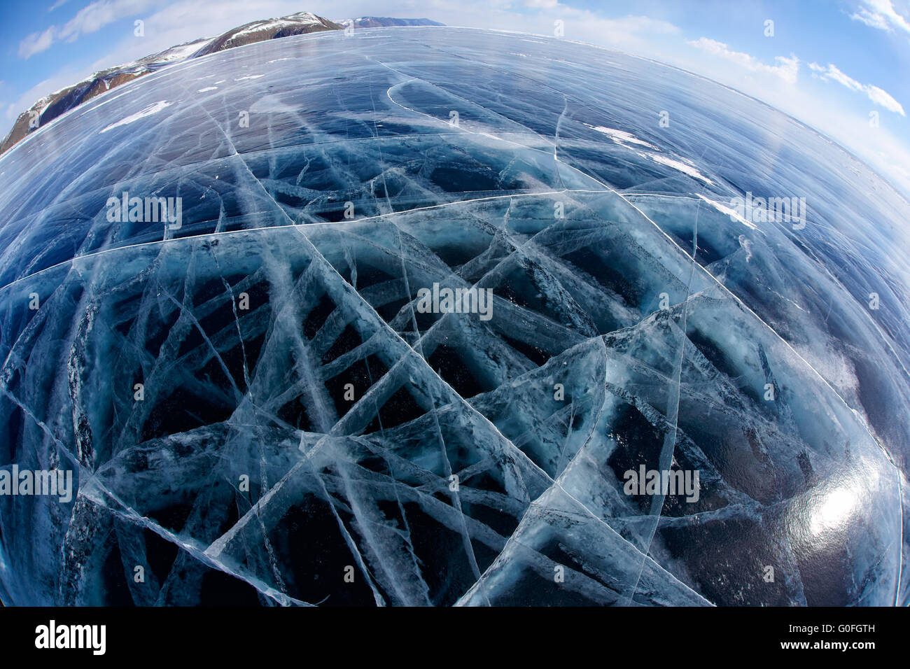 Winter ice landscape on Siberian lake Baikal with clouds Stock Photo ...