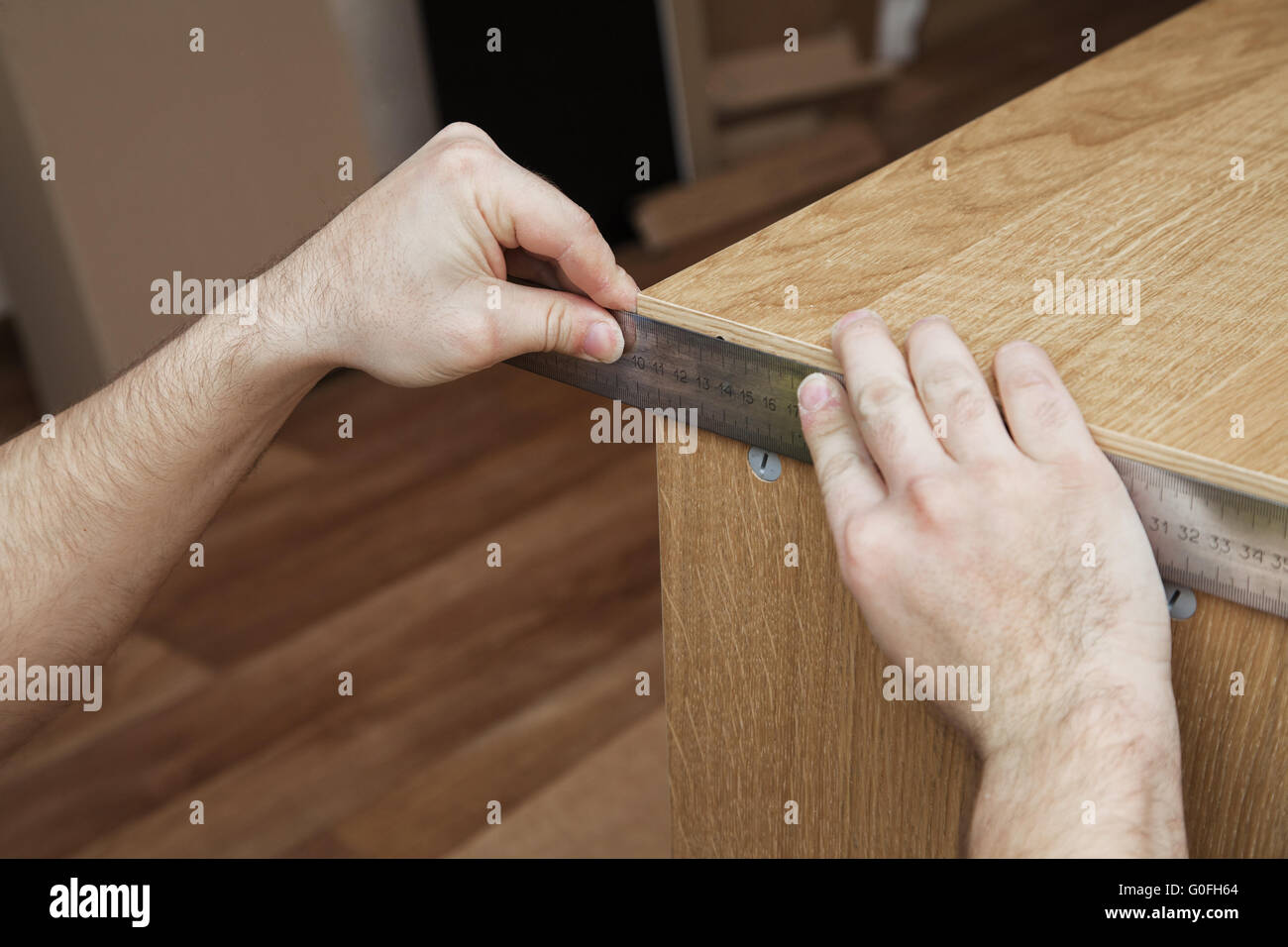 Hands with a ruler Stock Photo - Alamy