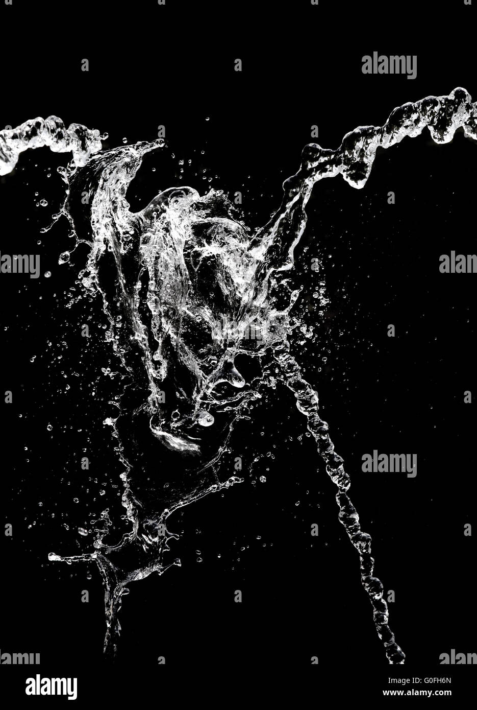 Splash of pouring water isolated over black background Stock Photo - Alamy