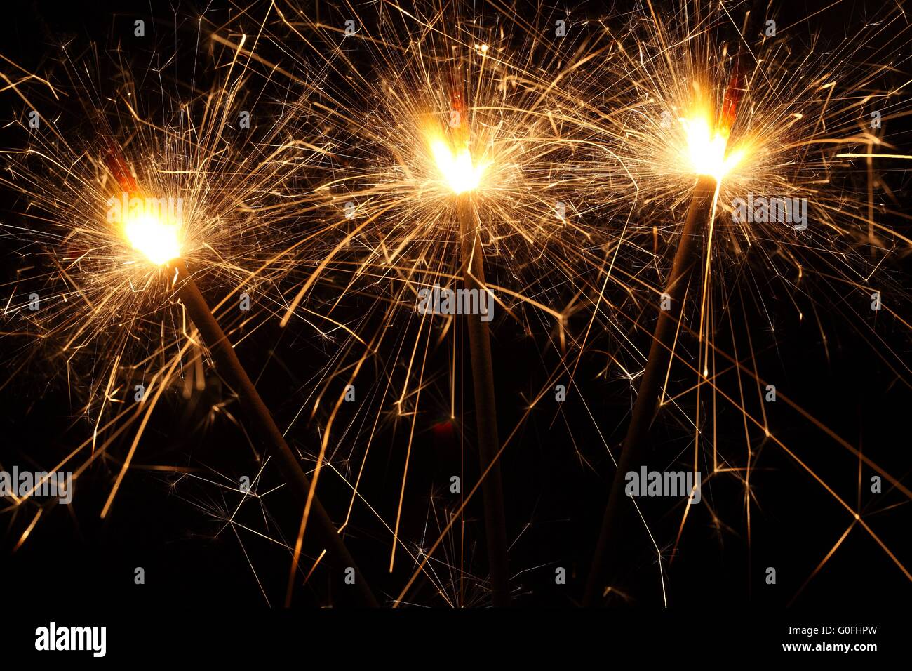 Macro photo of firework sparkler with black background Stock Photo - Alamy