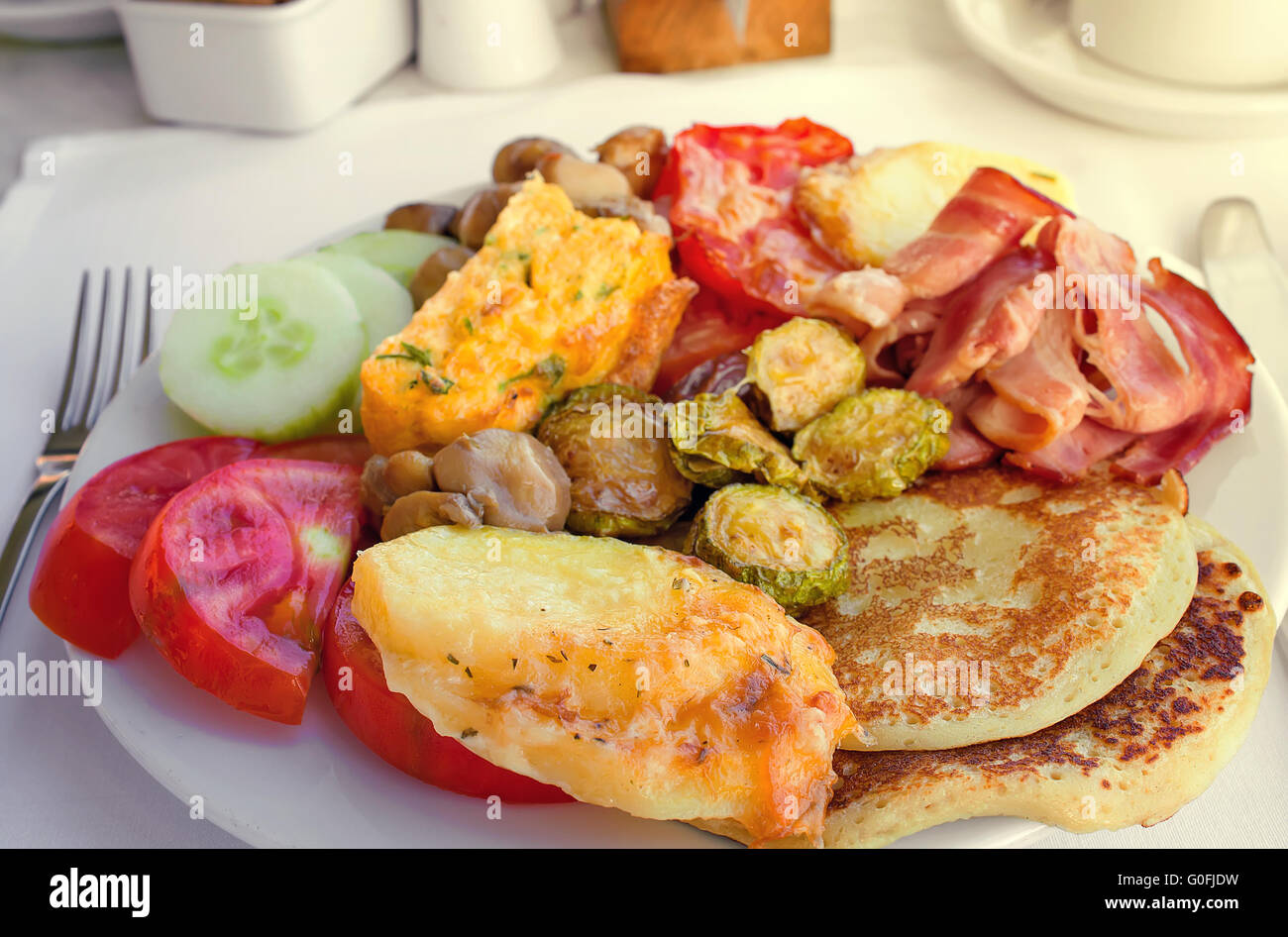 Meat, fish and various vegetable garnish on a plat Stock Photo - Alamy