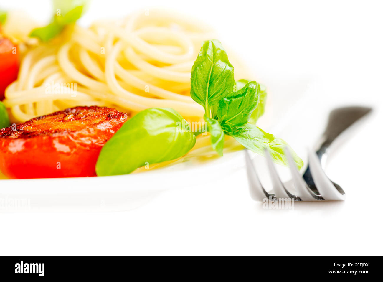 Traditional italian macaroni pasta with grilled tomato and oregano ...