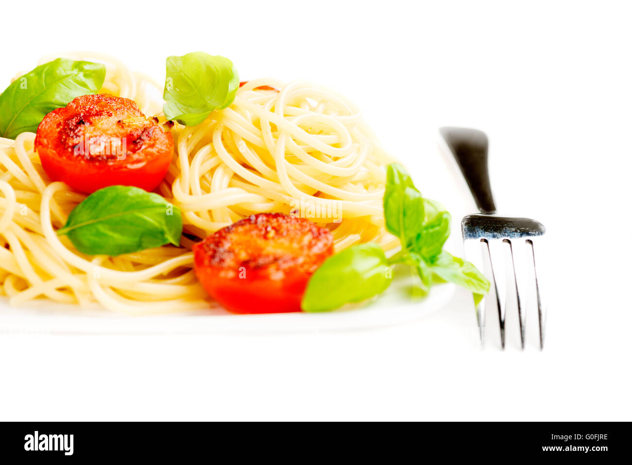 Traditional italian macaroni pasta with grilled tomato and oregano ...