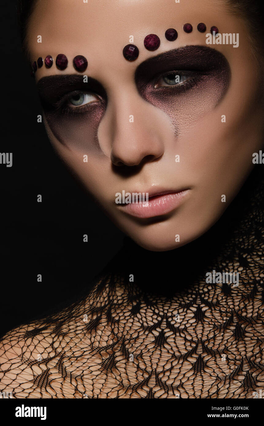 beautiful woman with face art and decorations Stock Photo - Alamy