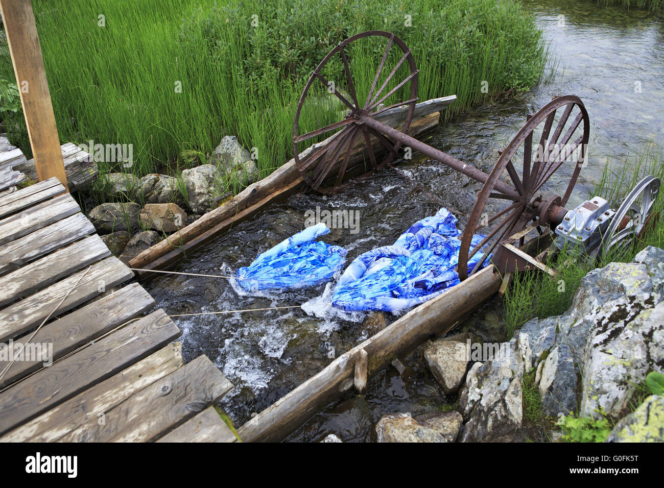 Adaptation for washing linen in a mountain river Stock Photo - Alamy