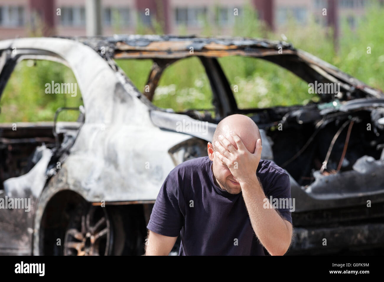 Crying upset man at arson fire burnt car vehicle Stock Photo - Alamy