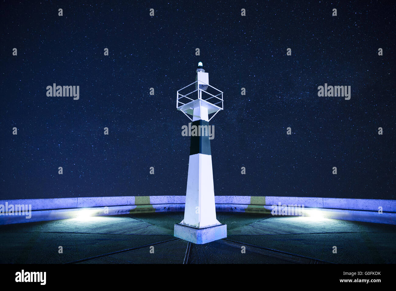 Lighthouse at starry night Stock Photo - Alamy