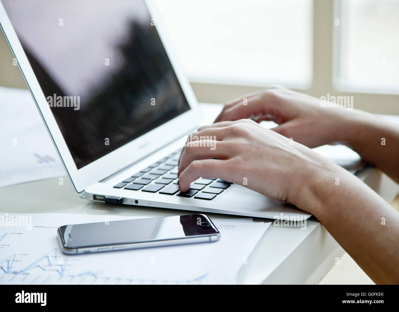 office work on notebook Stock Photo - Alamy