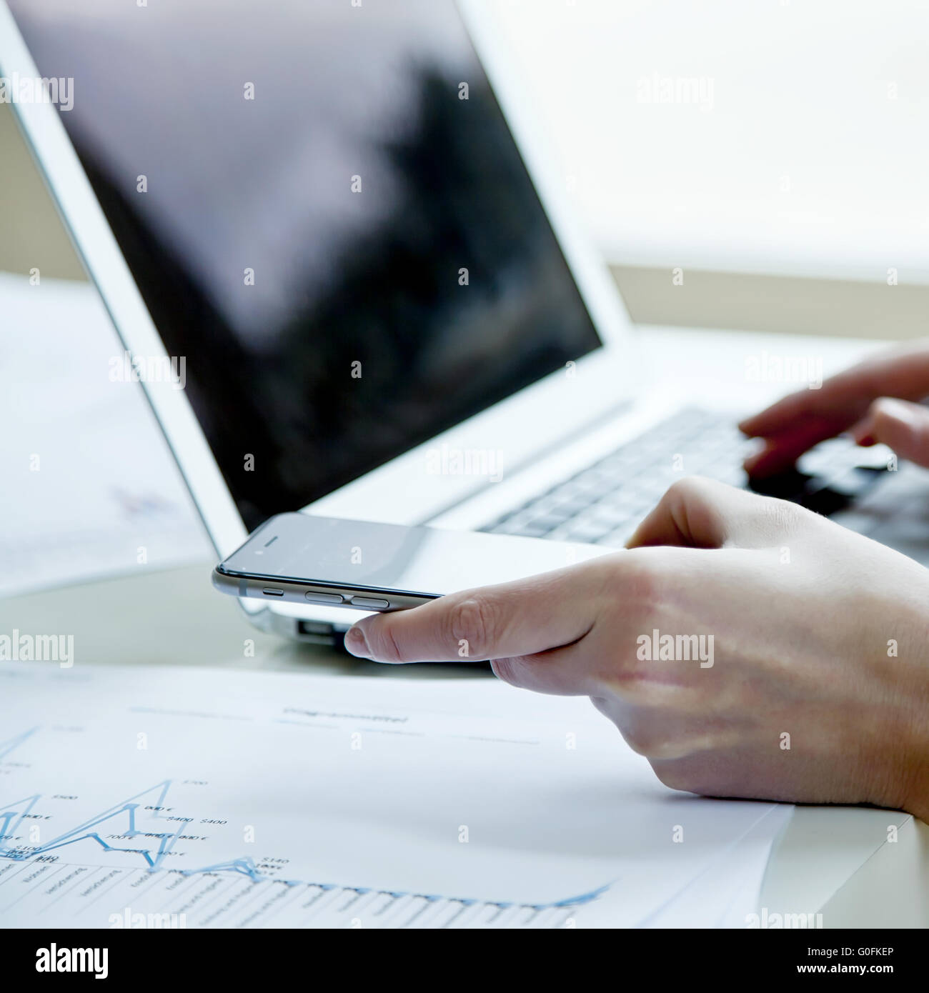 office work on notebook Stock Photo - Alamy