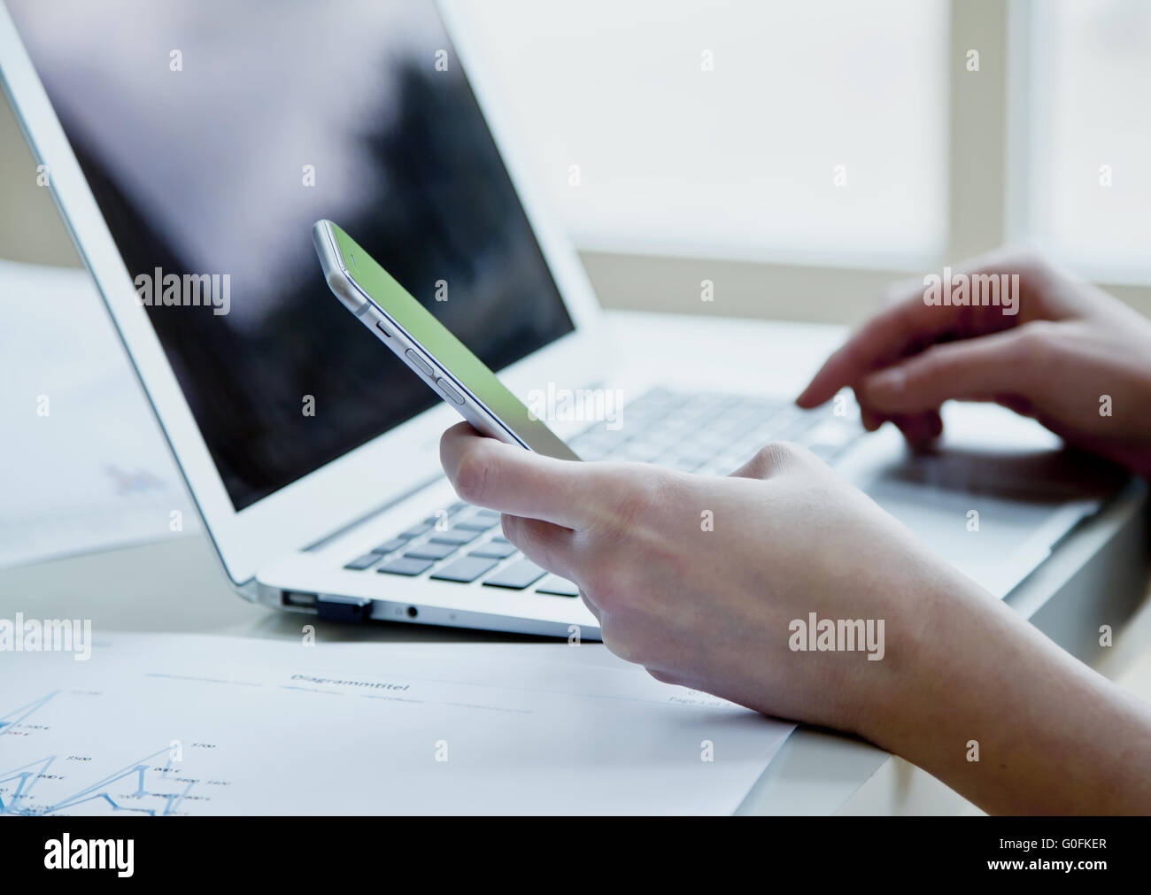 office work on notebook Stock Photo - Alamy