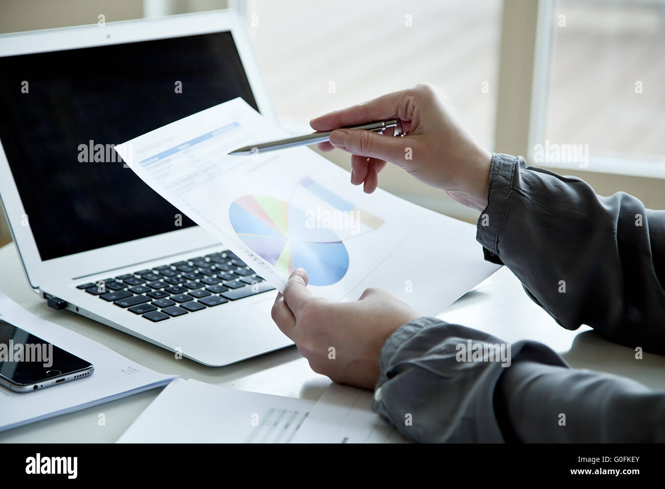 office work on notebook Stock Photo - Alamy