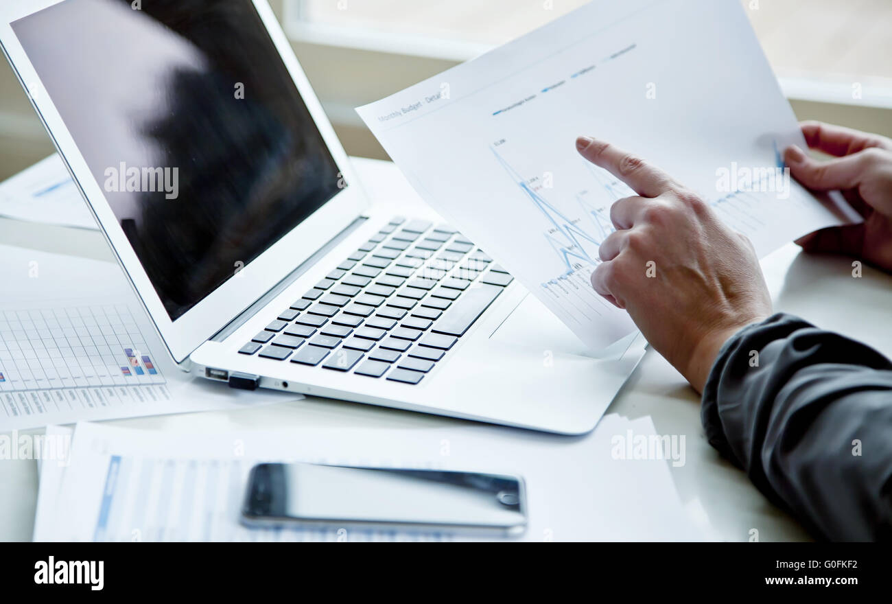 office work on notebook Stock Photo - Alamy