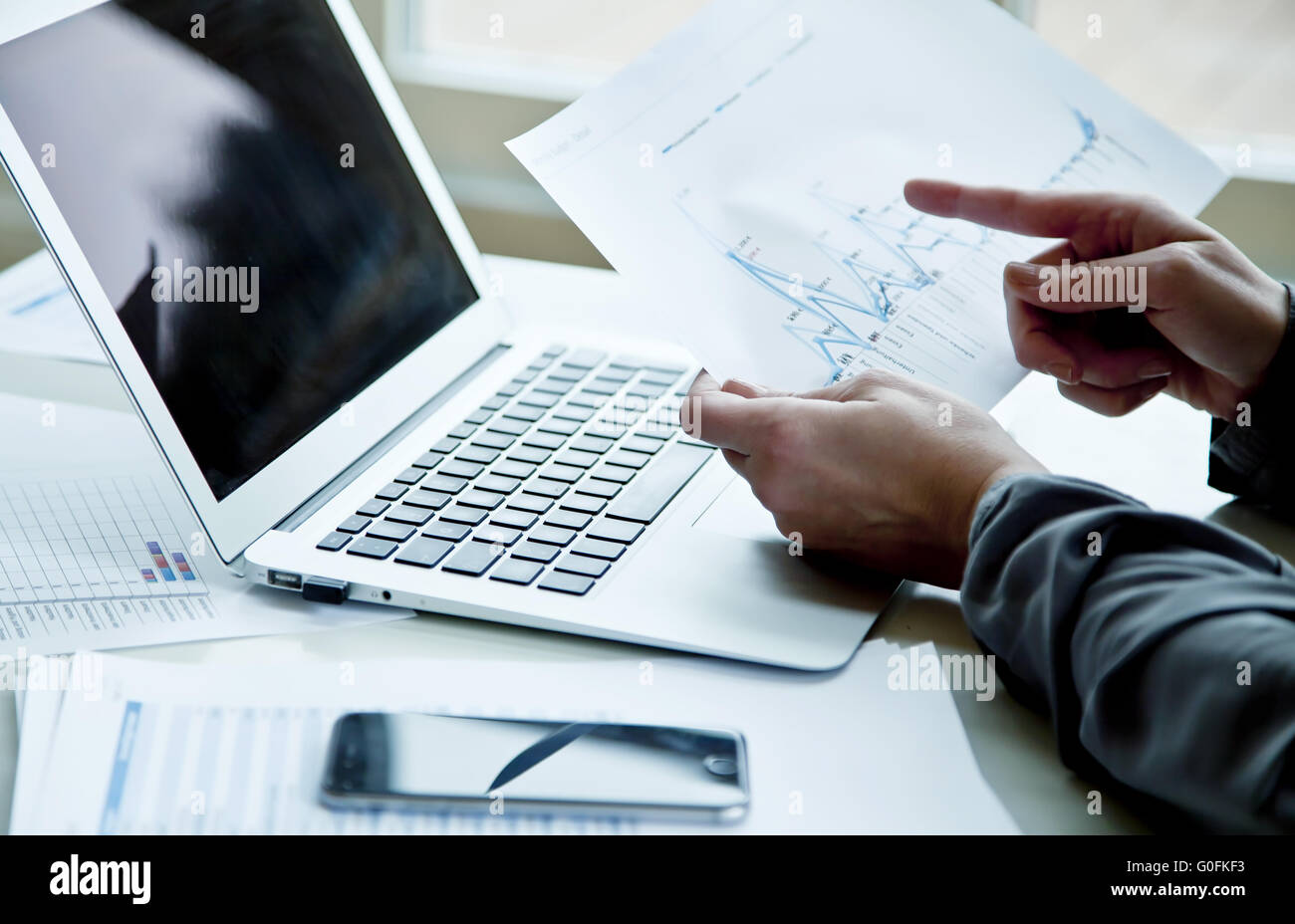 office work on notebook Stock Photo - Alamy