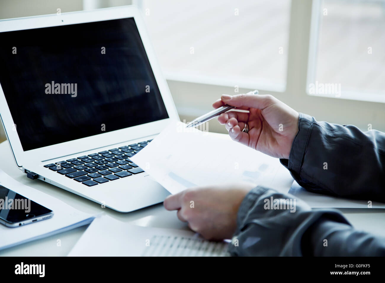 office work on notebook Stock Photo - Alamy