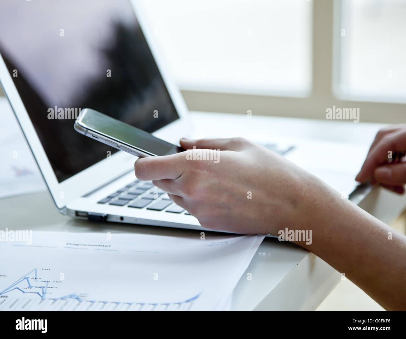 office work on notebook Stock Photo - Alamy