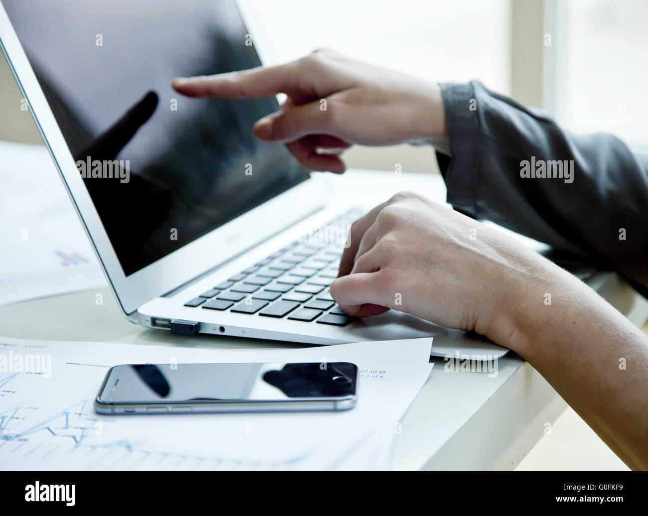 office work on notebook Stock Photo - Alamy