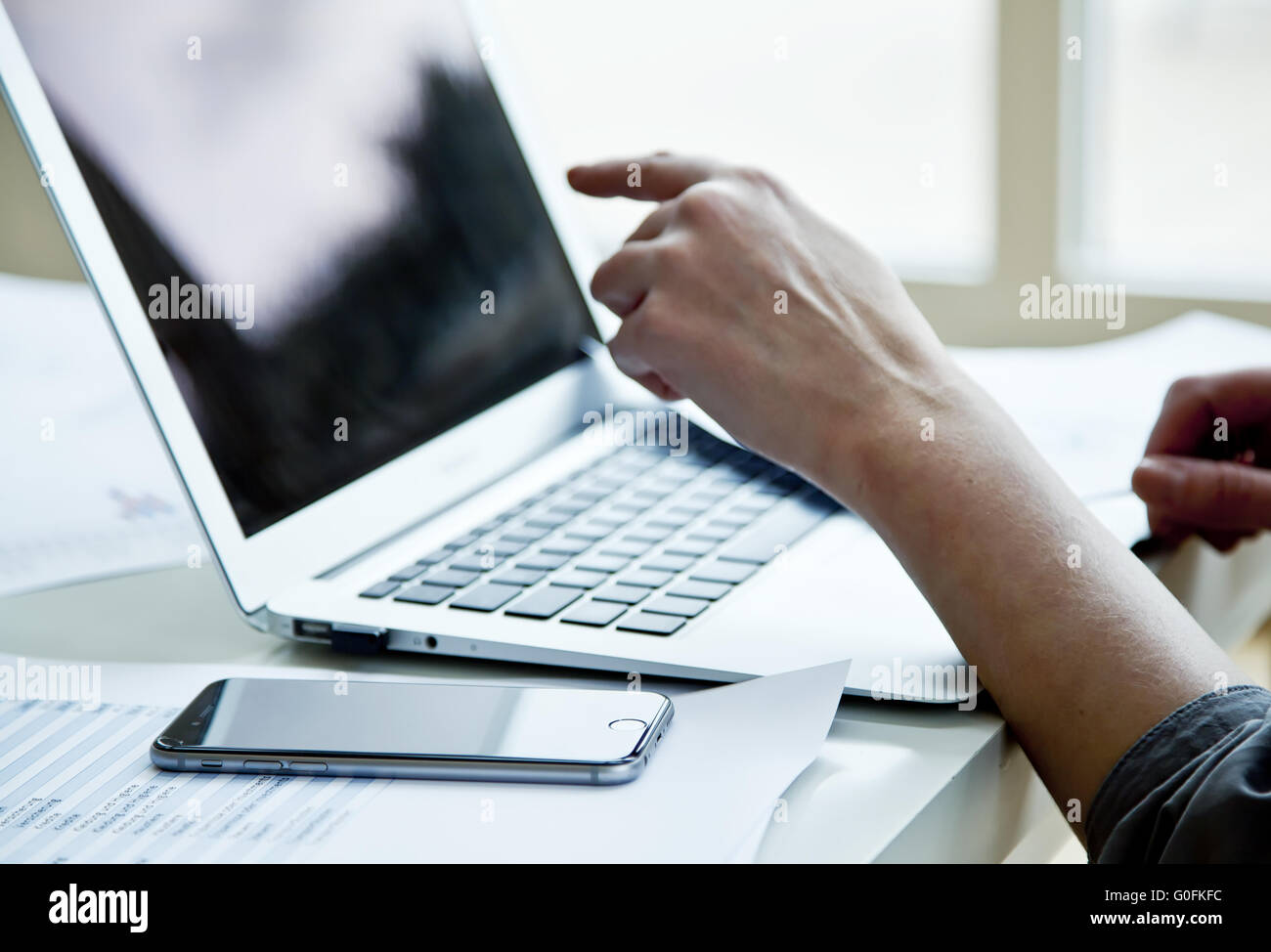 office work on notebook Stock Photo - Alamy