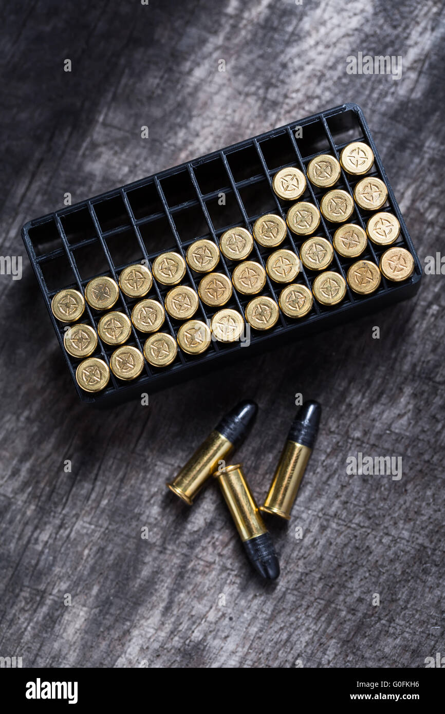Scattering of small caliber cartridges on a wooden background Stock ...