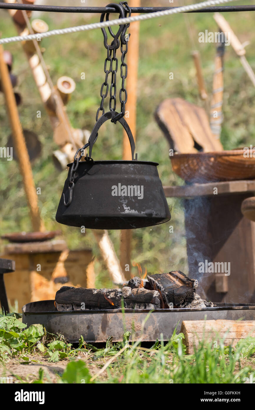 Saucepan over your campfire - cauldron Stock Photo - Alamy