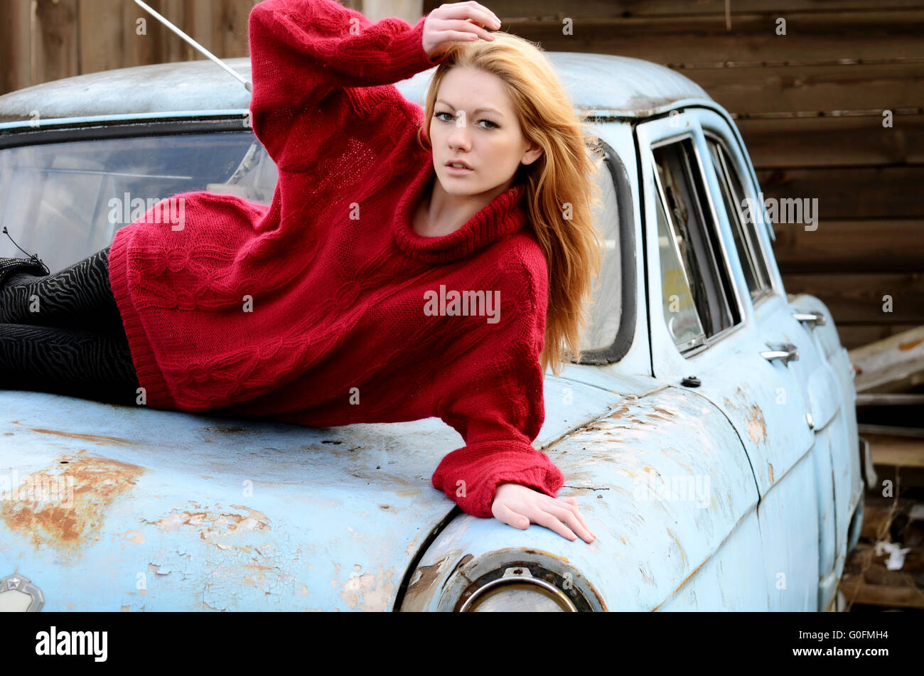 The beautiful woman on an old retro car Stock Photo - Alamy