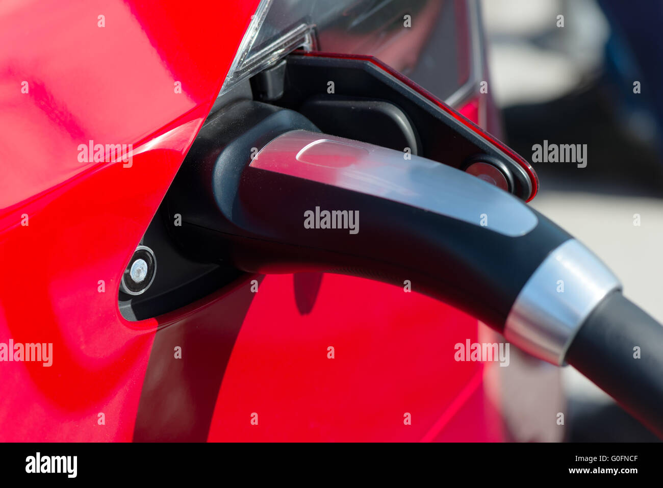 Charging red electric car Stock Photo - Alamy