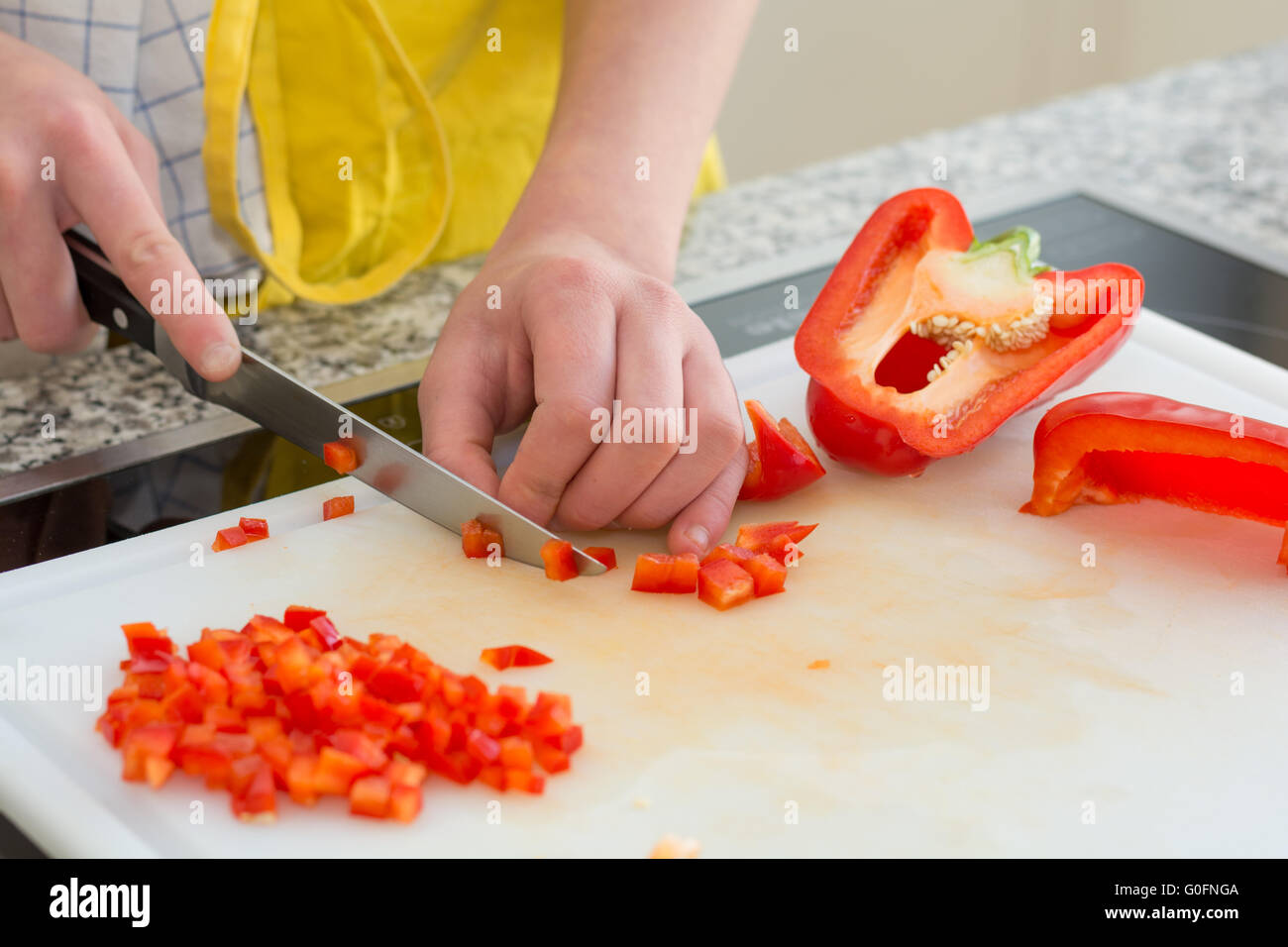 Cook cuts vegetables in kitchen hi-res stock photography and images - Alamy