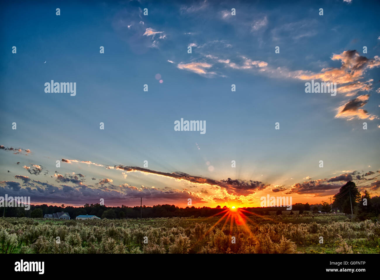 sun setting over country farm land in york south carolina Stock Photo ...