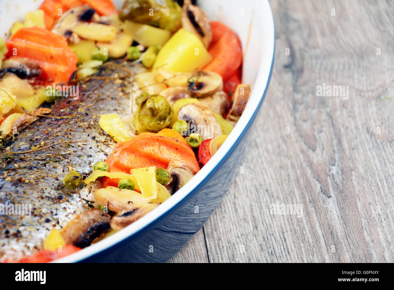 Baked seabass fish Stock Photo - Alamy